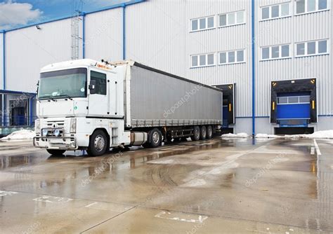 unloading big container trucks at warehouse building stock editorial