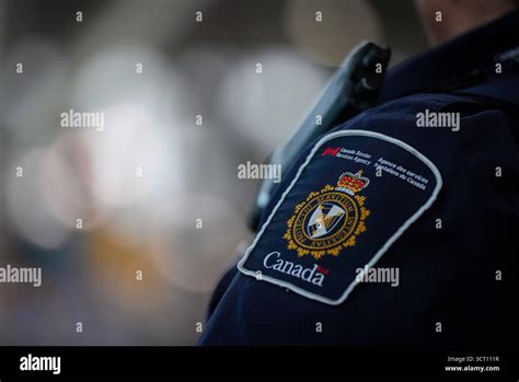 A Canada Border Services Agency Patch Is Seen On The Uniform Of A Cbsa