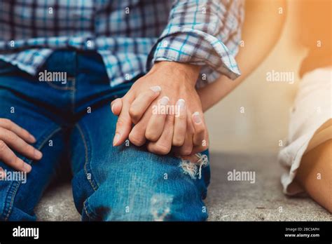 A Young Couple In Love Touched Hands On The First Date Loving Couple
