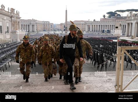 Members Of The Military Walk Towards St Peter Basilicas Holy Door On