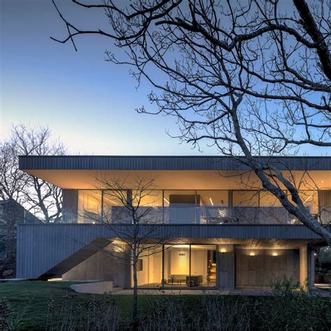 Desai Chia Architecture Perches Blackened Ledge House On Rocky Hillside