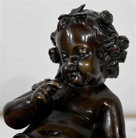 Bronze " Putto with a bow " - XIXth century - B... | Antikeo