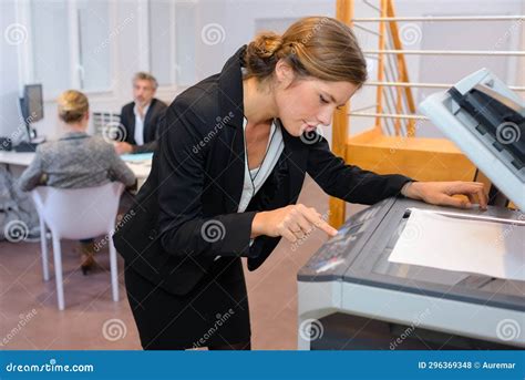 Man Making Photocopy Of Document On A Copy Machine With Access Control For Key Card Stock