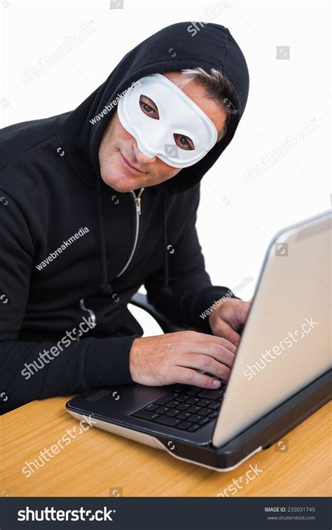 Hacker White Mask Using Laptop Looking Stock Photo 235031749 Shutterstock