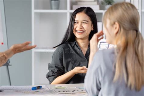 Joyful Ux Ui Design Collaboration With Team Members Sharing Ideas And Feedback Stock Image