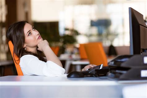 Man Daydreaming At Work