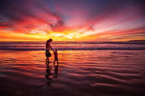 Mother And Son Having Fun At Sunset On The Beach Stock Image Image Of Tropical Summer