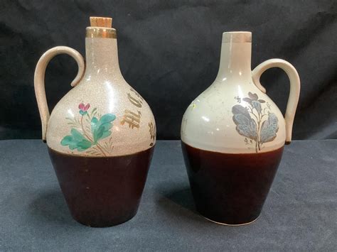 Lot Two Antique Stoneware Whisky Jugs Including Rare M C Russell