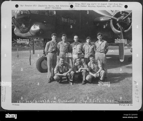 Armament Personnel Of The 18th Combat Mapping Squadron Pose Beside The