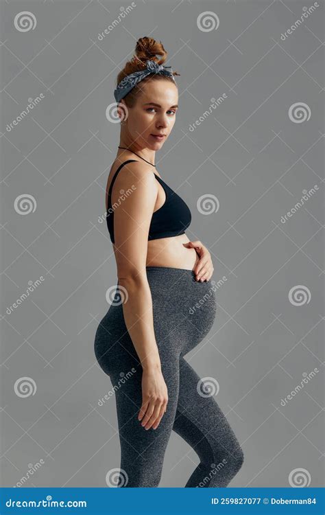 Cute Pregnant Belly Isolated On Gray Side View Of Young Pregnant Woman