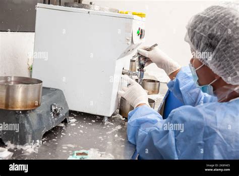 Scientist Embedding Tissues In Paraffin Blocks For Sectioning Pathology Laboratory Cancer