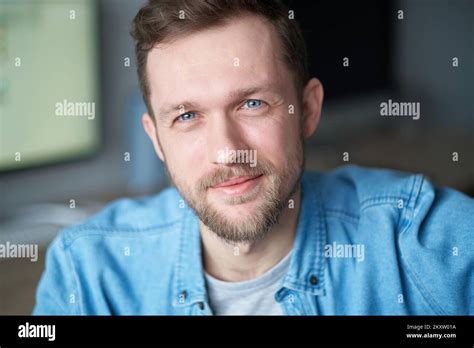 Handsome Man In Denim Shirt Positive Emotion With Computer Monitor On Background Portrait Of