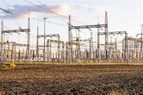 High Voltage Electricity Towers Transmission Power Lines And Distribution Substations Stock