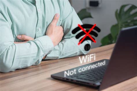 adult man using a computer laptop to connect to wifi in office but wifi
