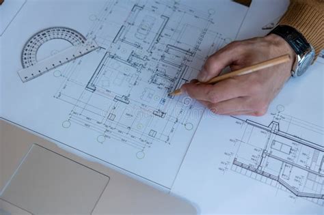 Architect Drawing Blueprint Sketching Design Of House Making Architectural Construction