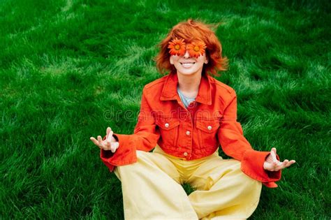 Relaxed Happy Smiling Redhead Woman With Freckles And Red Orange Gerbera Flower Sunglasses