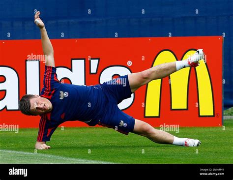 Russias Andrei Arshavin Stretches During A Training Session At The