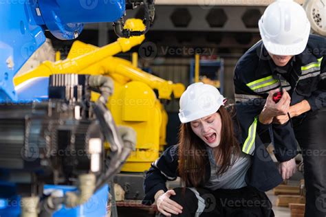 A Female Worker Suffered A Leg Accident While Working In Robotic Arms Factory And Male