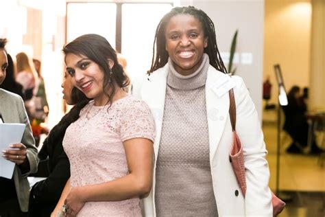 Diverse Woman Networking At Corporate Convention Event Editorial