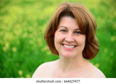 Portrait Smiling Middleaged Woman Bare Shoulders Stock Photo 664627477