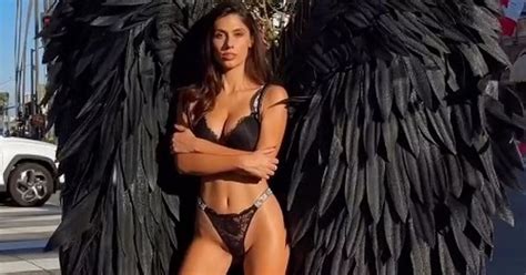 Model Strips To Underwear And Angel Wings In Middle Of Road As Men Stare In Awe Daily Star