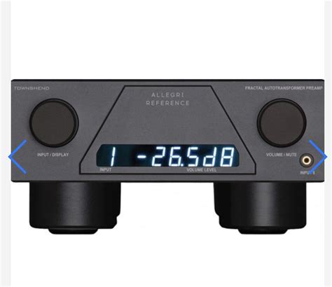 Analog Clock Radio On Black Speaker System