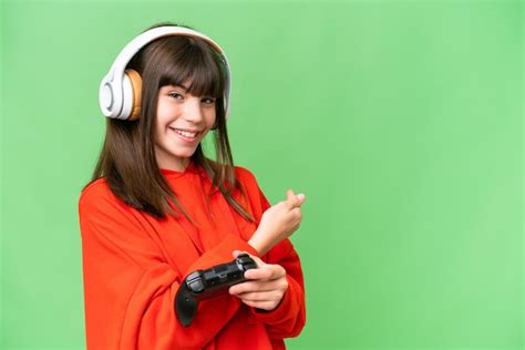 Premium Photo Little Caucasian Girl Playing With A Video Game Controller Over Isolated
