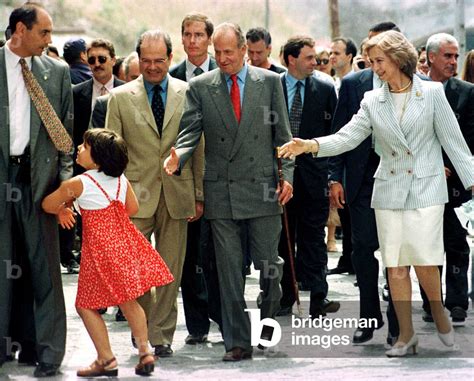 Image Of A Bodyguard Restrains A Girl Who Had Jumped The Security By