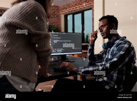 Software Developers Sitting At Desk And Developing A Functional Data