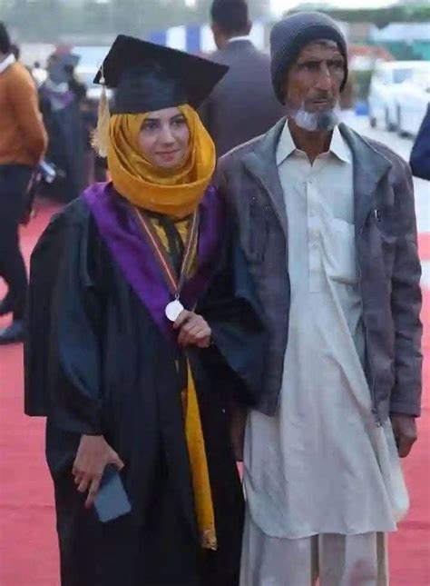 This Is A Picture Of A Karachi University Graduate With Her Father