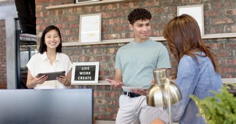 Collaborating On Interior Design Project Multiracial Team Using Digital Tablets In Modern