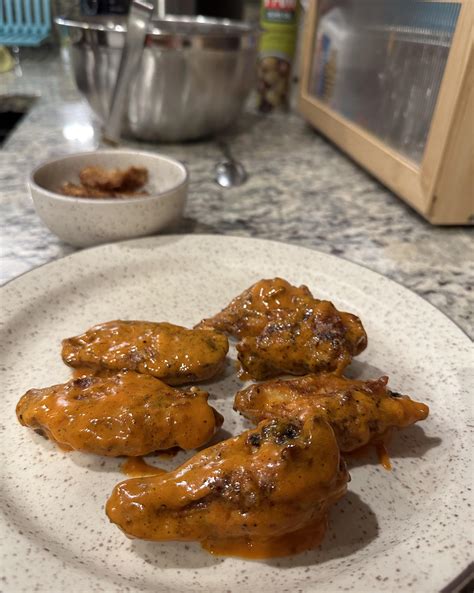 Made some buffalo garlic wings in my air fryer. Little bowl is naked wings for my 2 year old ...