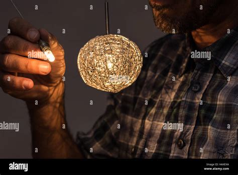 Man Changing Halogen Lamp Stock Photo Alamy