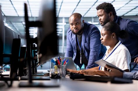 Server Hub It Staff Members Debugging And Optimizing Code Free Photo