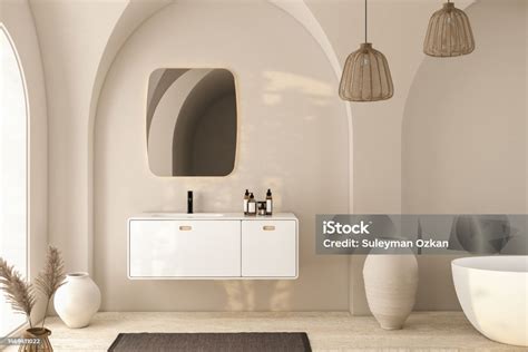 흰색 세면대와 타원형 거울 욕조 꽃병에 담긴 건조한 식물 화강암 바닥에 카펫이 있는 밝고 최소한의 욕실 인테리어 호텔 스튜디오의 목욕 액세서리와 창문 3d 렌더링 0명에