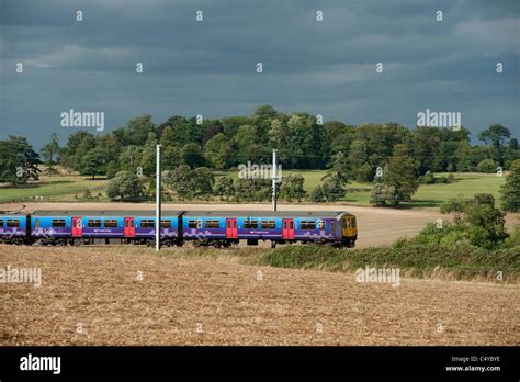 Class 319 Train In First Capital Connect Livery Travelling Through The