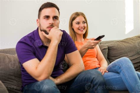 Angry Wife And Husband Are Having Conflict Because Wife Is Watching Tv