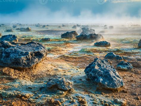 Volcanic Geothermal Landscape With Steaming Rocks And Mineral Deposits