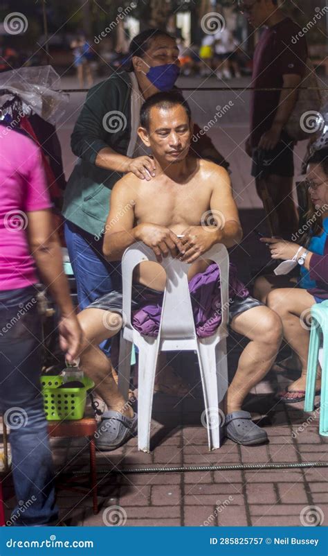 Filipino Locals Receive Massage Treatmentsalong The Popular Rizal