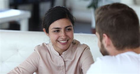 Cheerful Friendly Young Indian Woman Flirting With Handsome Caucasian