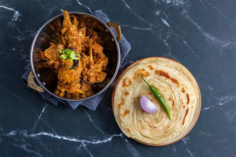 Crispy Flaky Laccha Paratha Paired With Rich Spicy Chicken Bhuna