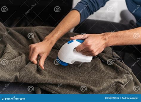 Man Removes Fabric Pills Using Lint Shaver Stock Image Image Of