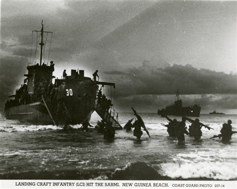 Us Servicemen Debarking From Uss Lci L 30 Onto A Beach Sarmi 1944