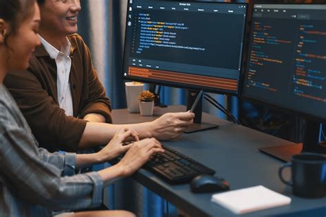 Premium Photo It Developers Discussing With Point Website Coding