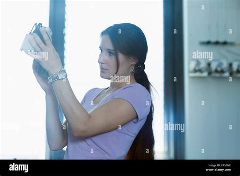 Female Technician Examining Electrical Component In An Industrial Plant Freiburg Im Breisgau