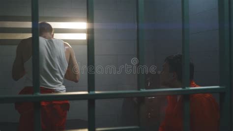 Criminals In Orange Uniforms Talk Hit Each Other In Jail Stock Footage Video Of Imprisonment