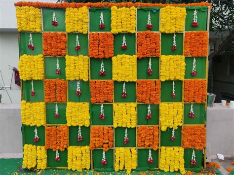 Vibrant Haldi Function Decoration With Orange And Yellow Flowers