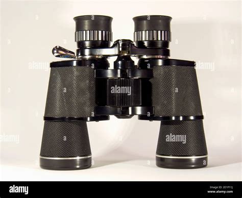 Close Up Photography Of Vintage Black Binoculars Over White Background