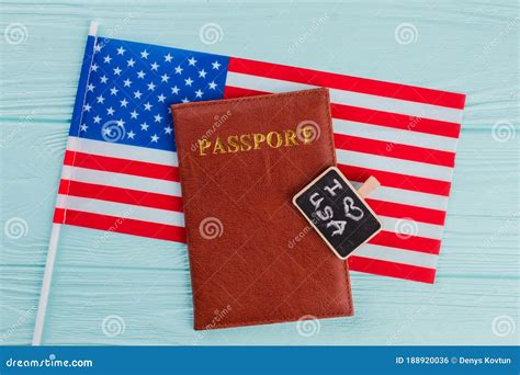 Us Passport And Flag Over A Citizenship And Naturalization Certificate