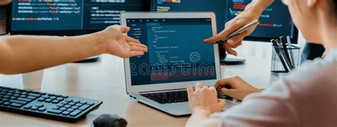 two smart computer engineers working together to solve program code